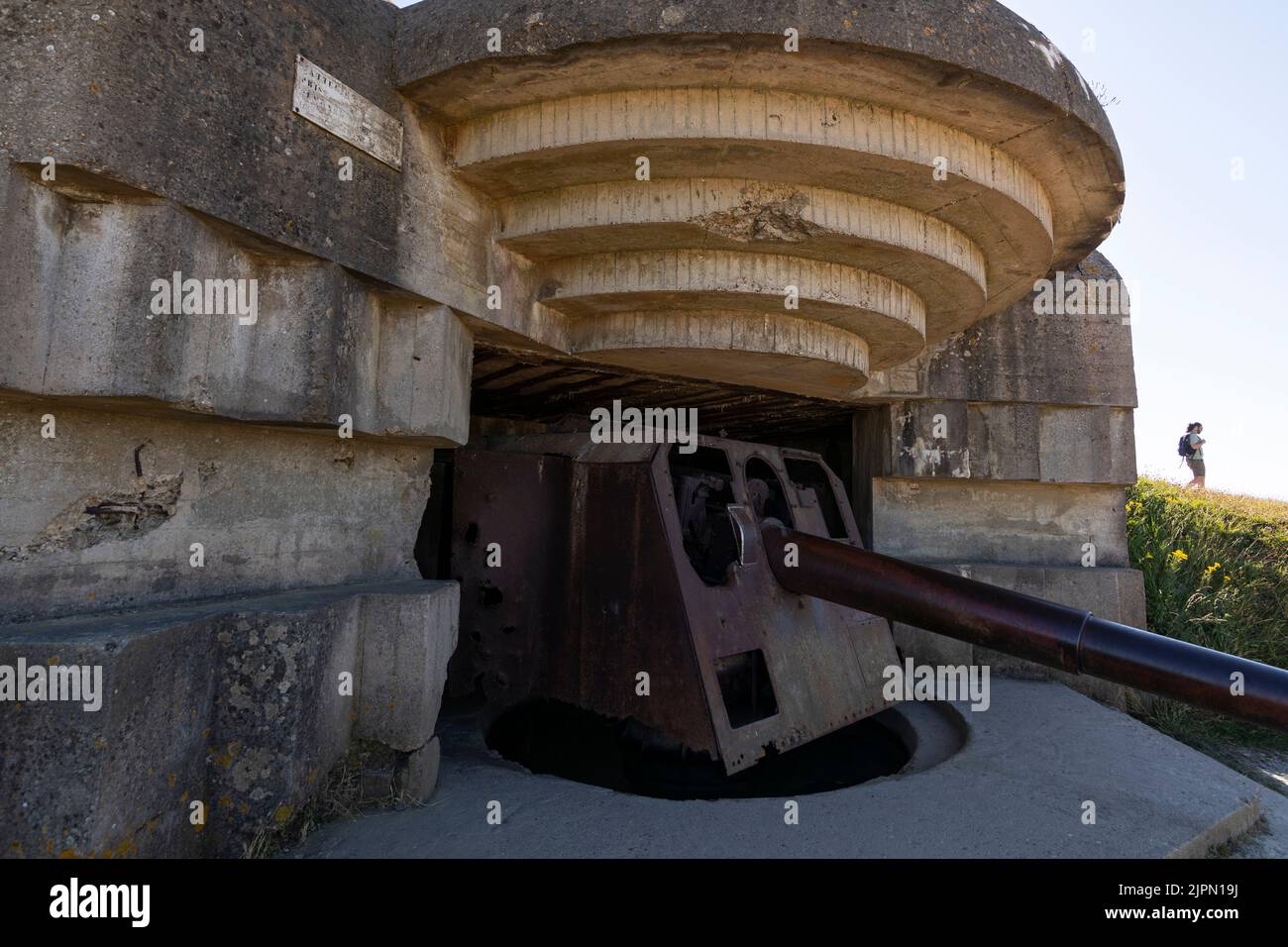 Gun at a bunker at the Atlantic wall in Longues-sur-Mer, Normandy ...