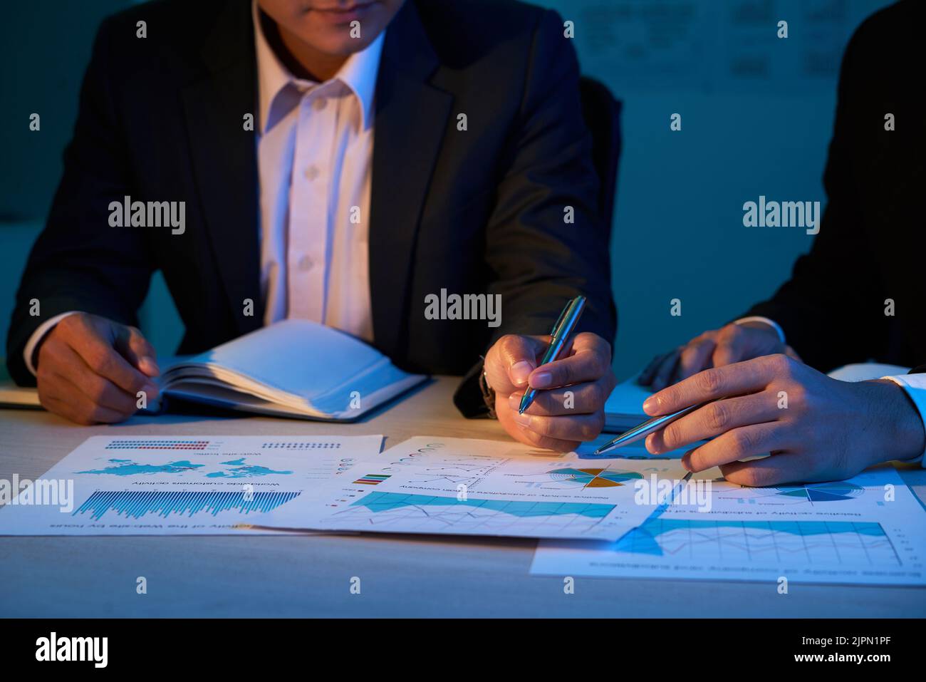 Discussing financial charts hi-res stock photography and images - Alamy