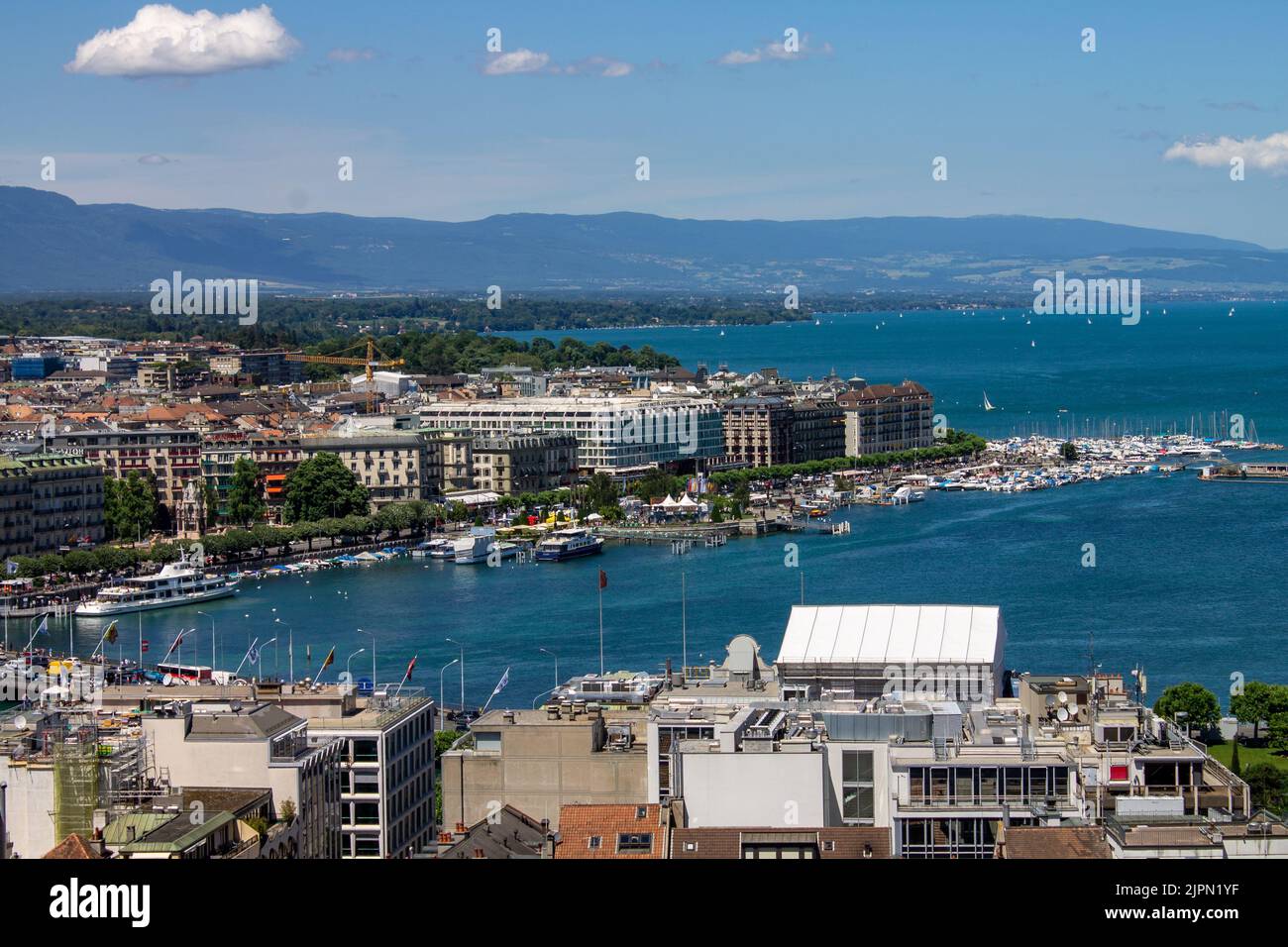 The historical buildings and the fountain, and Lake Geneva, Switzerland ...