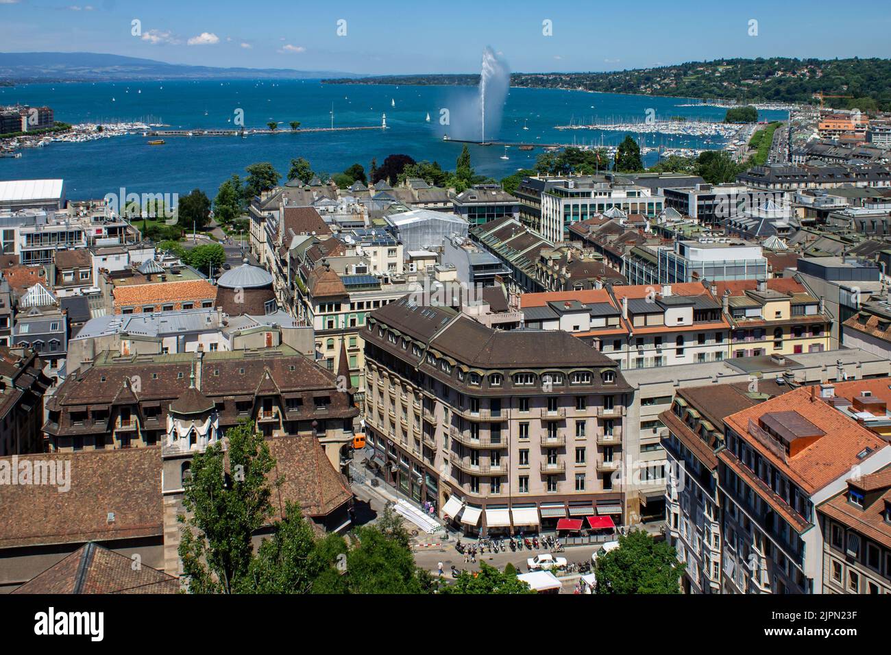 The historical buildings and the fountain, and Lake Geneva, Switzerland ...