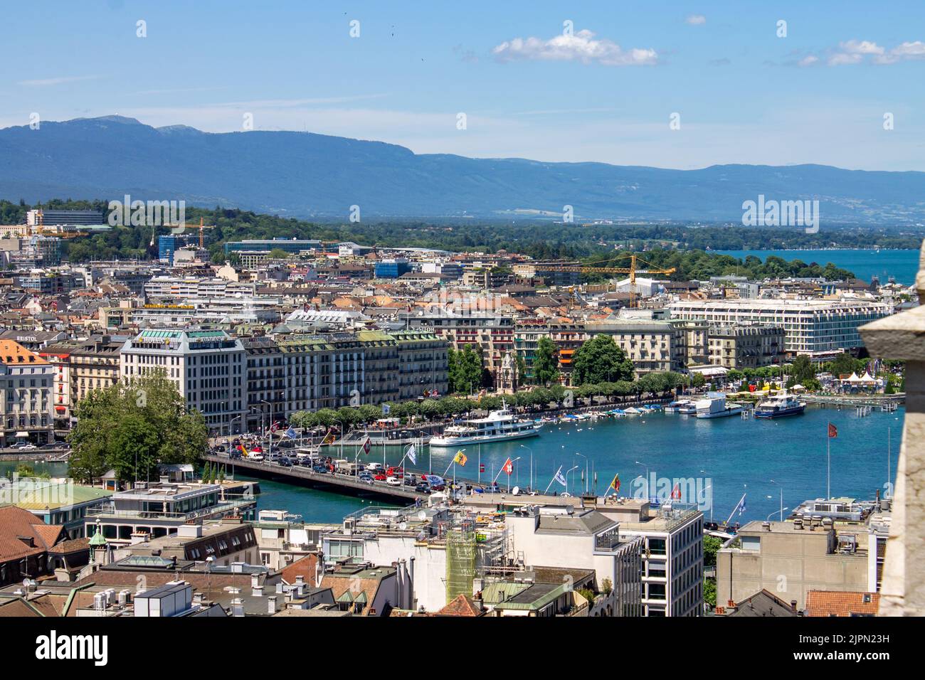 The historical buildings and the fountain, and Lake Geneva, Switzerland ...
