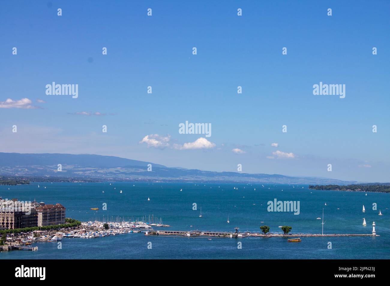The historical buildings and the fountain, and Lake Geneva, Switzerland ...