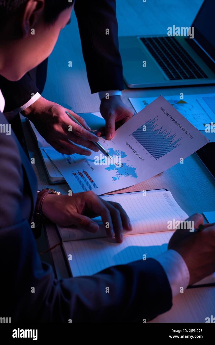 Businessman explaining document coworker hi-res stock photography and ...