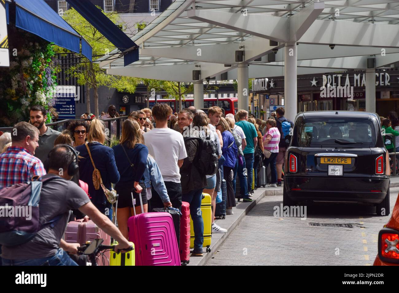 London, UK. 19th Aug, 2022. A huge queue forms at a taxi rank outside ...