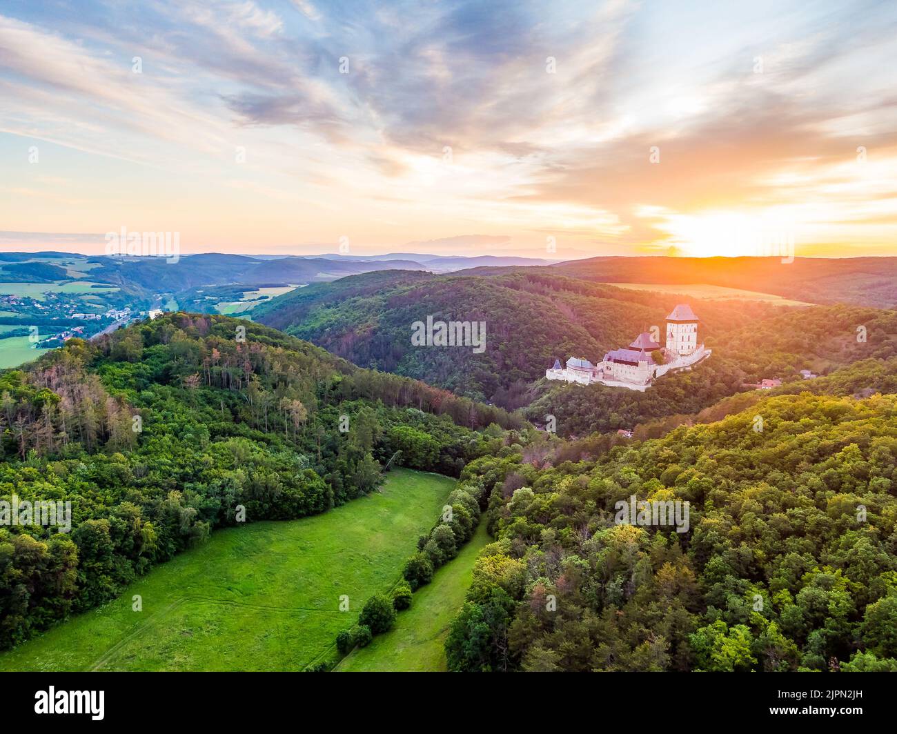 Aerial view of beautiful sunset over the Karlstejn castle, Czech ...