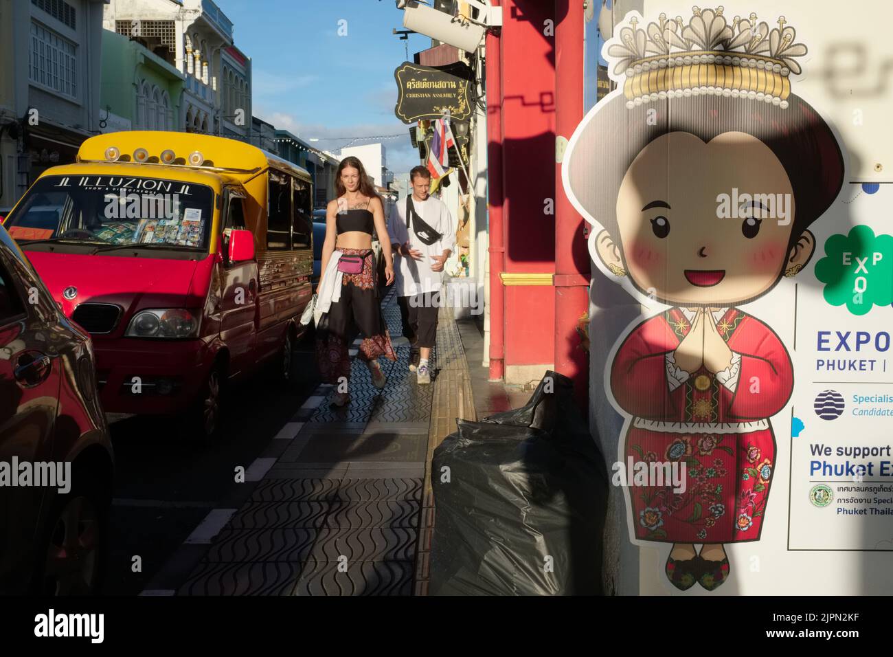 Western tourists sightseeing in Thalang Road in the Old Town area of ...