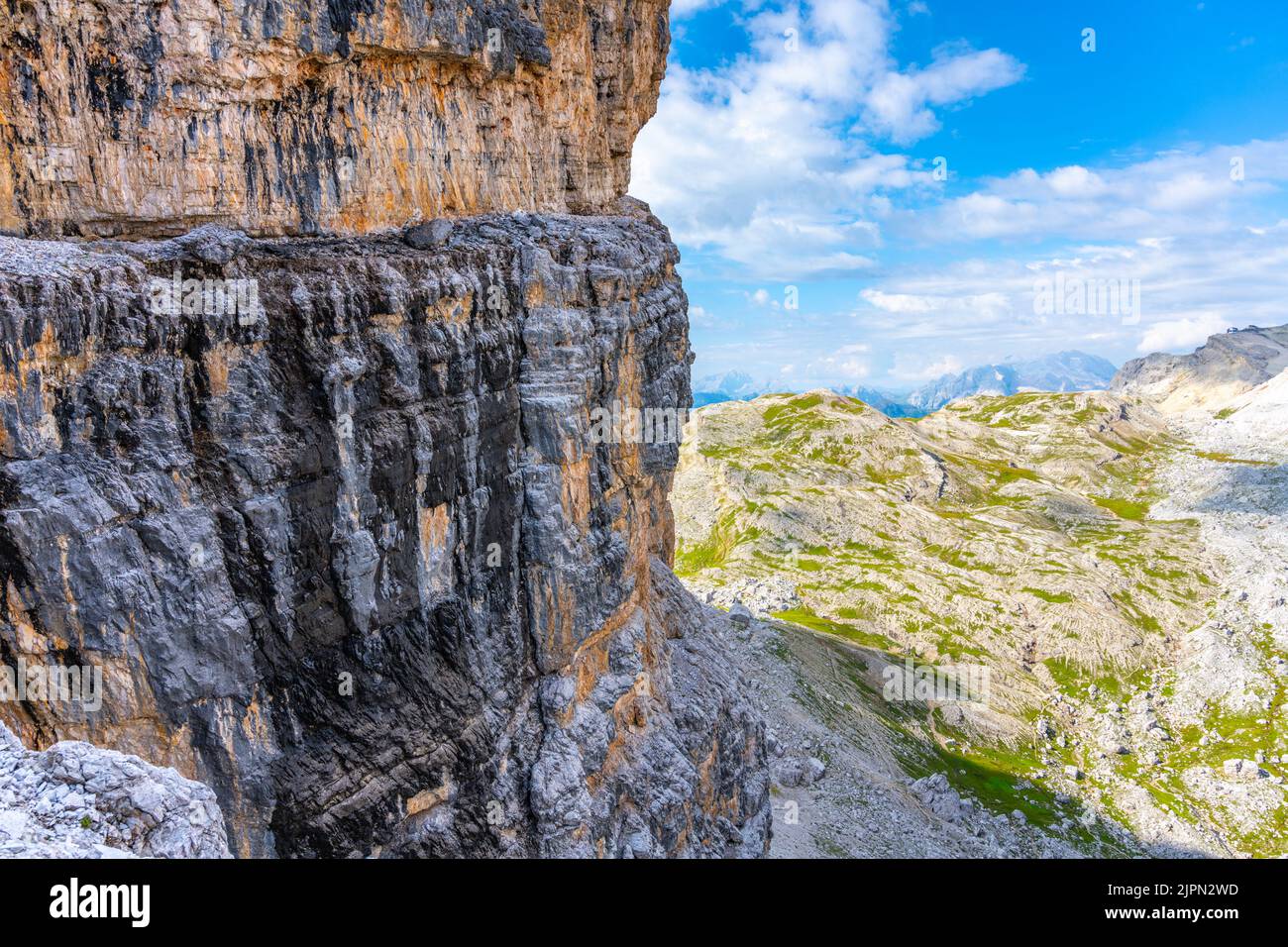 Tourist path in vertical wall of high mountain Stock Photo - Alamy