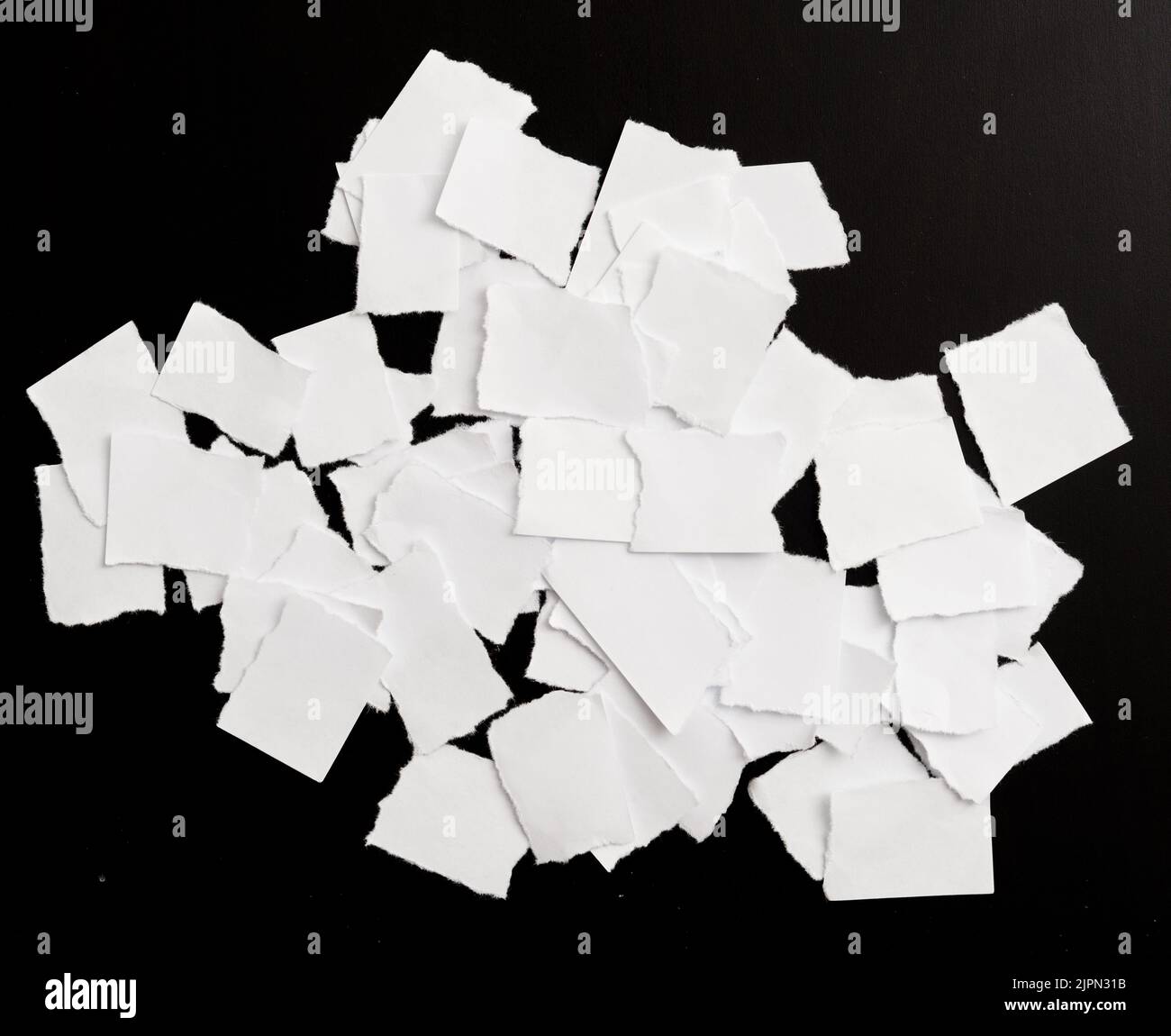 White torn paper on black background Stock Photo - Alamy