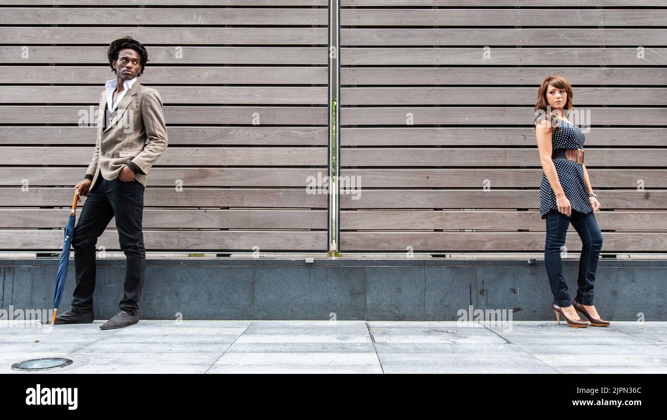 Breaking Down the Wall. Concept of an unstable relationship set against ...