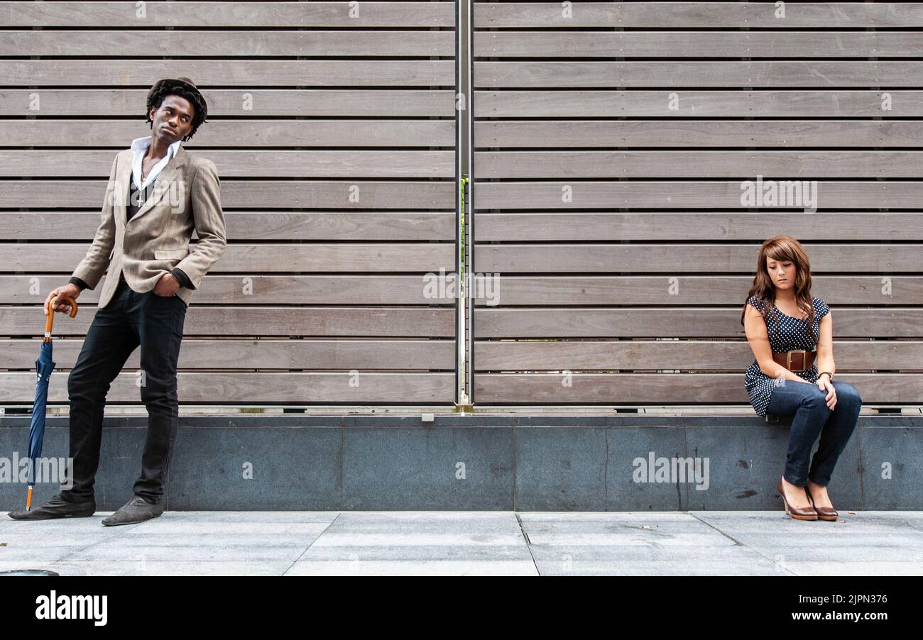 Breaking Down the Wall. Concept of an unstable relationship set against ...