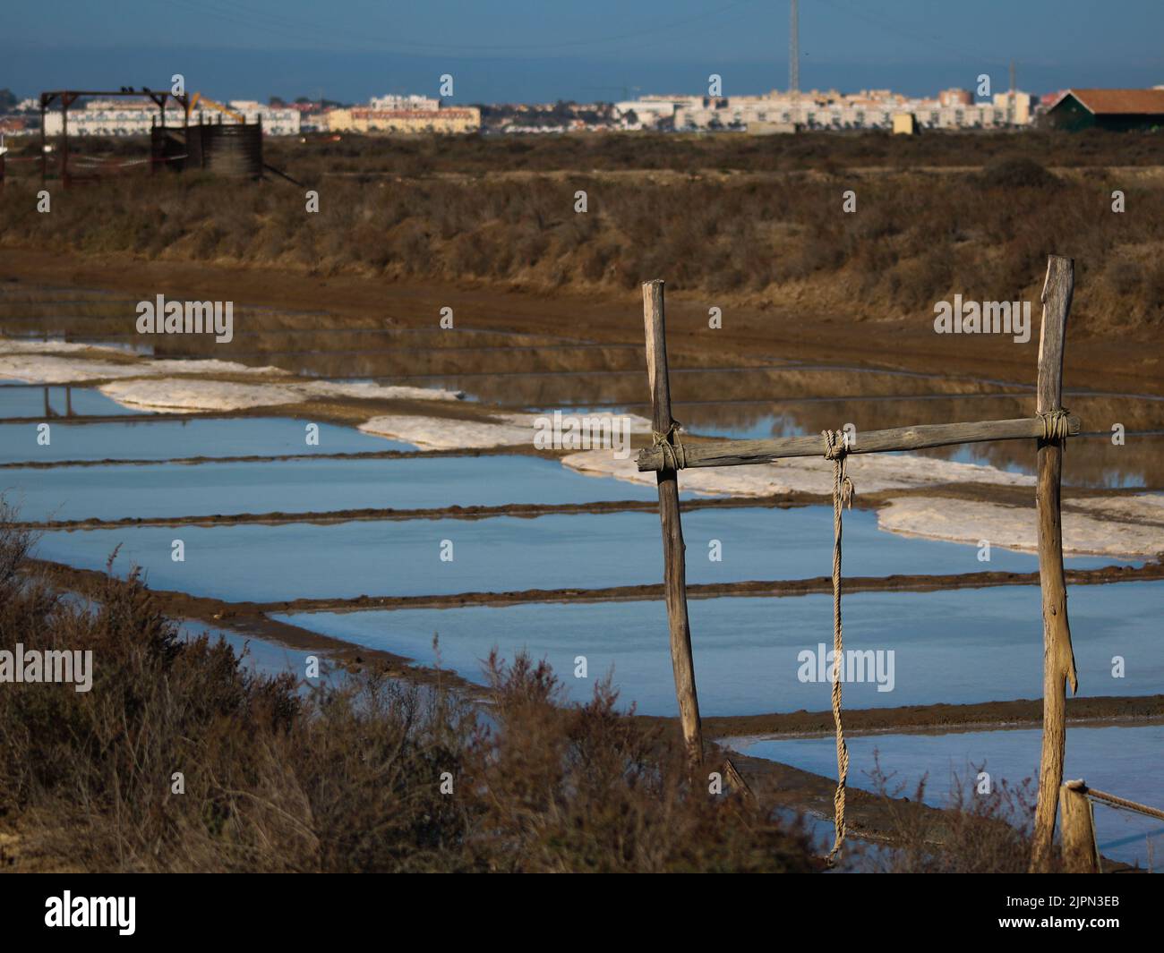 The salt marsh in the brown field behind wooden fence Stock Photo - Alamy