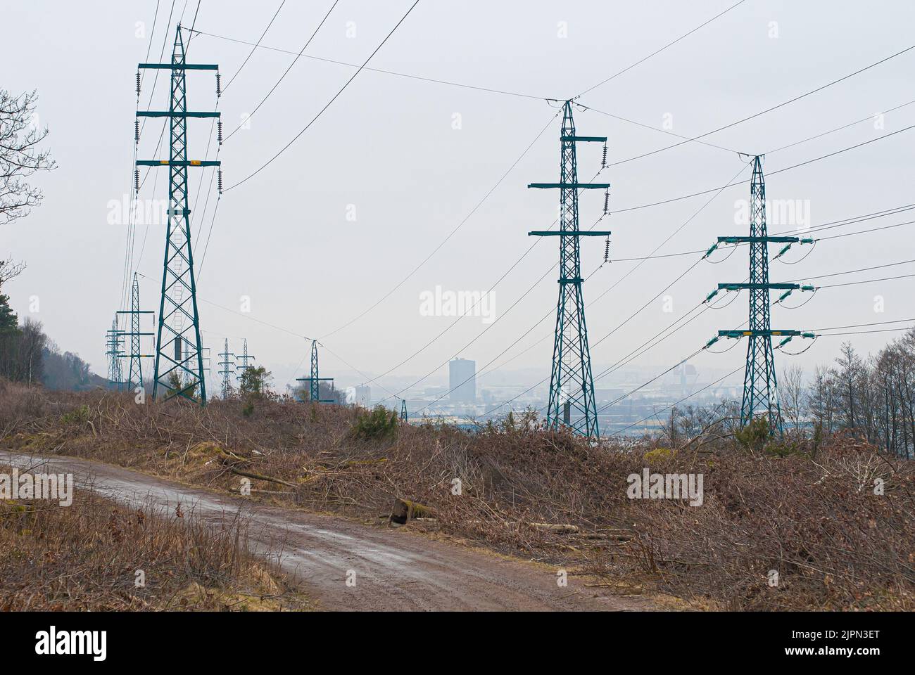 A dry field with transmission towers Stock Photo - Alamy