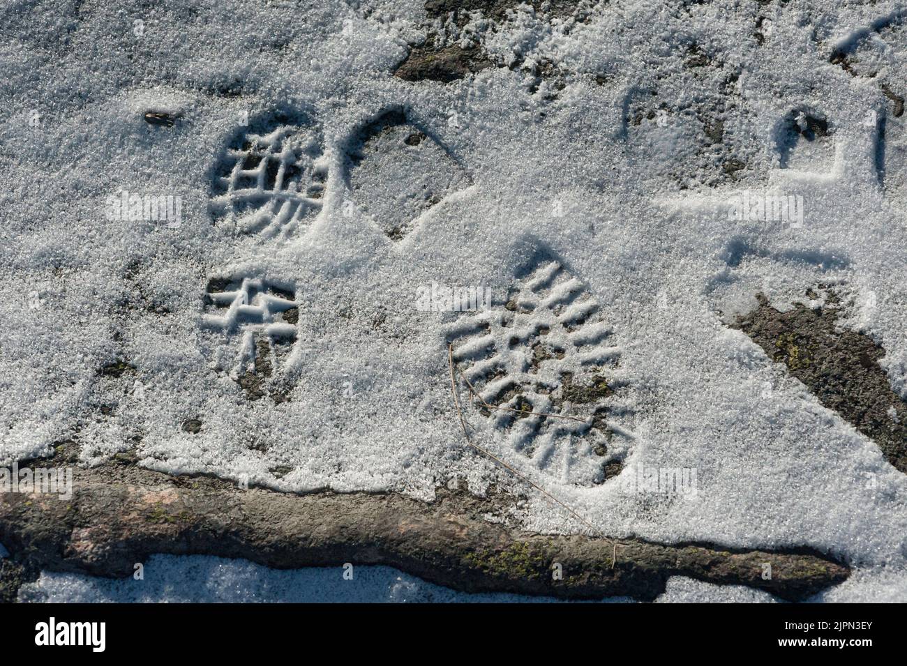 The footsteps on the snowy ground Stock Photo - Alamy