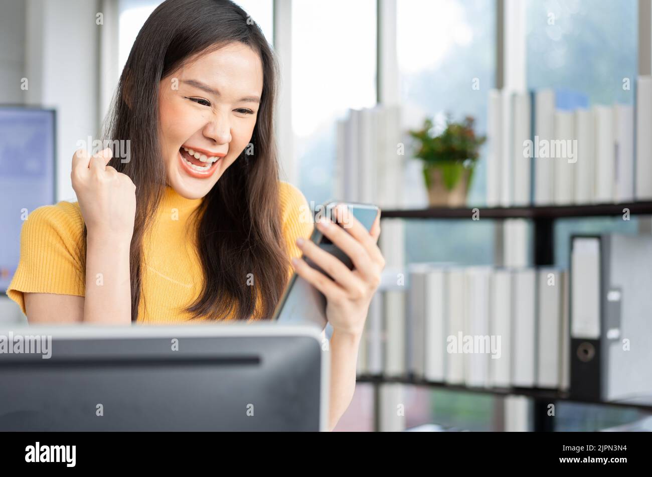 Portrait happy young programmer Asian woman work at start up technology ...