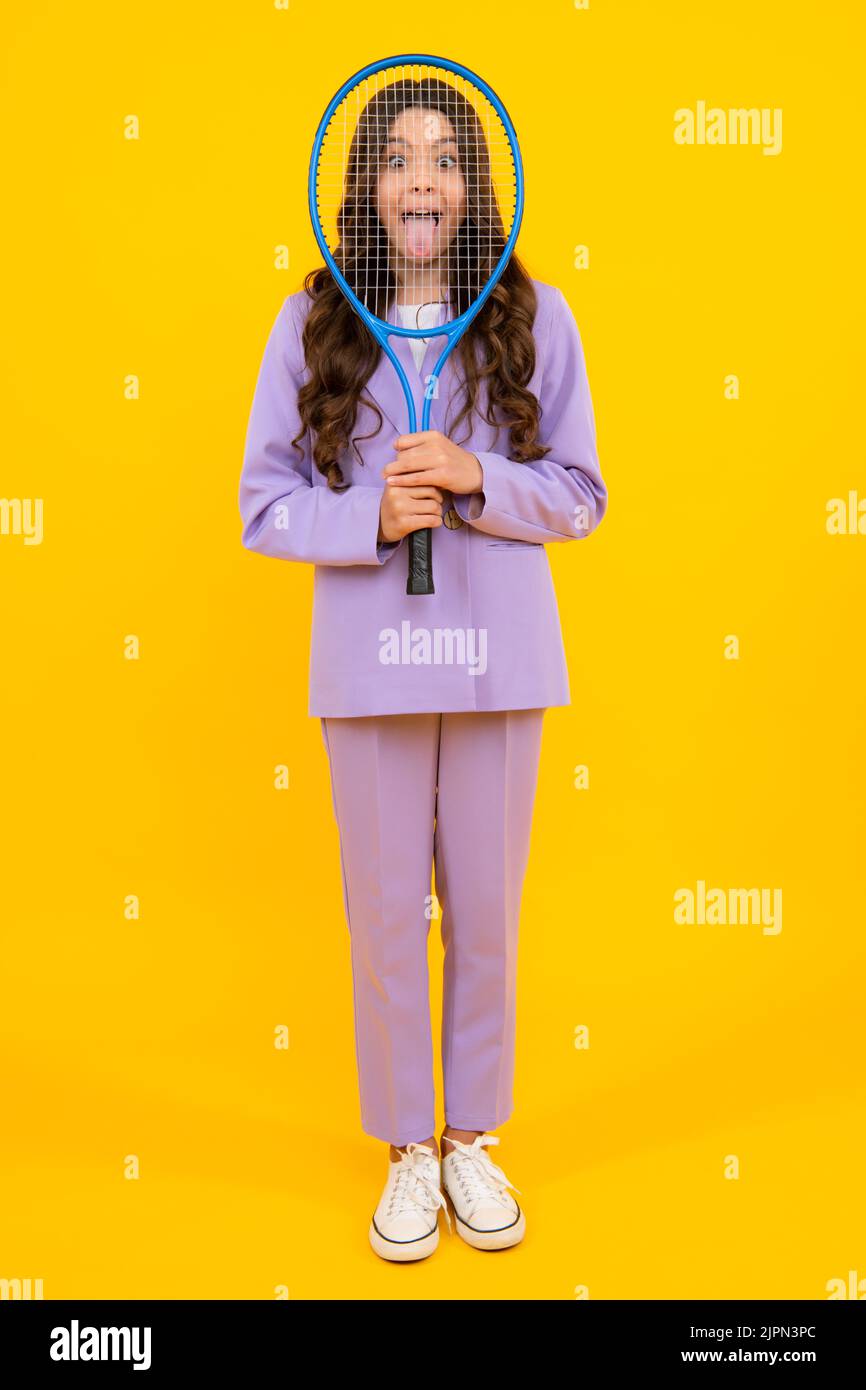 Funny face. Teenager tennis player girl hold tennis racket over ...