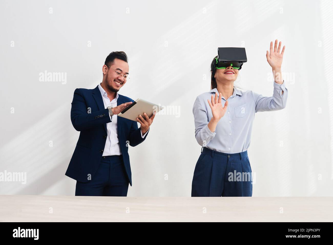 Group of Asian developers gathered together at modern office and ...