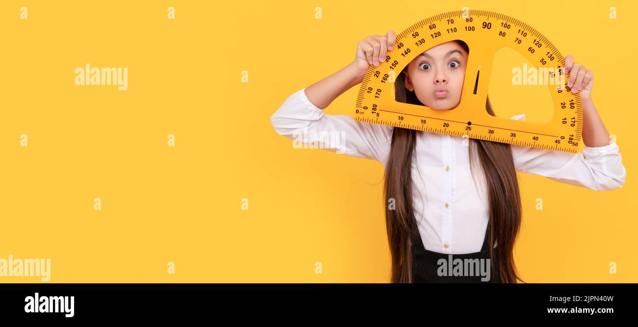funny teen girl in school uniform hold mathematics protractor for ...
