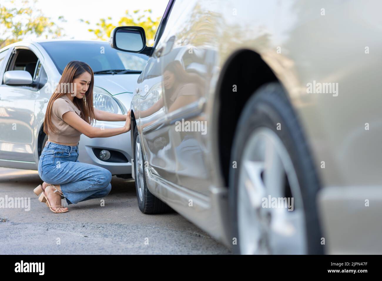 Women drivers sad after a car accident because not have car accident ...