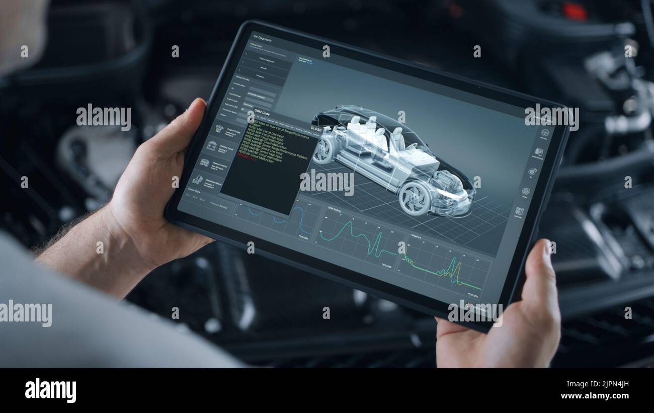 A car repairman performs wireless diagnostics of a car, scanning for ...