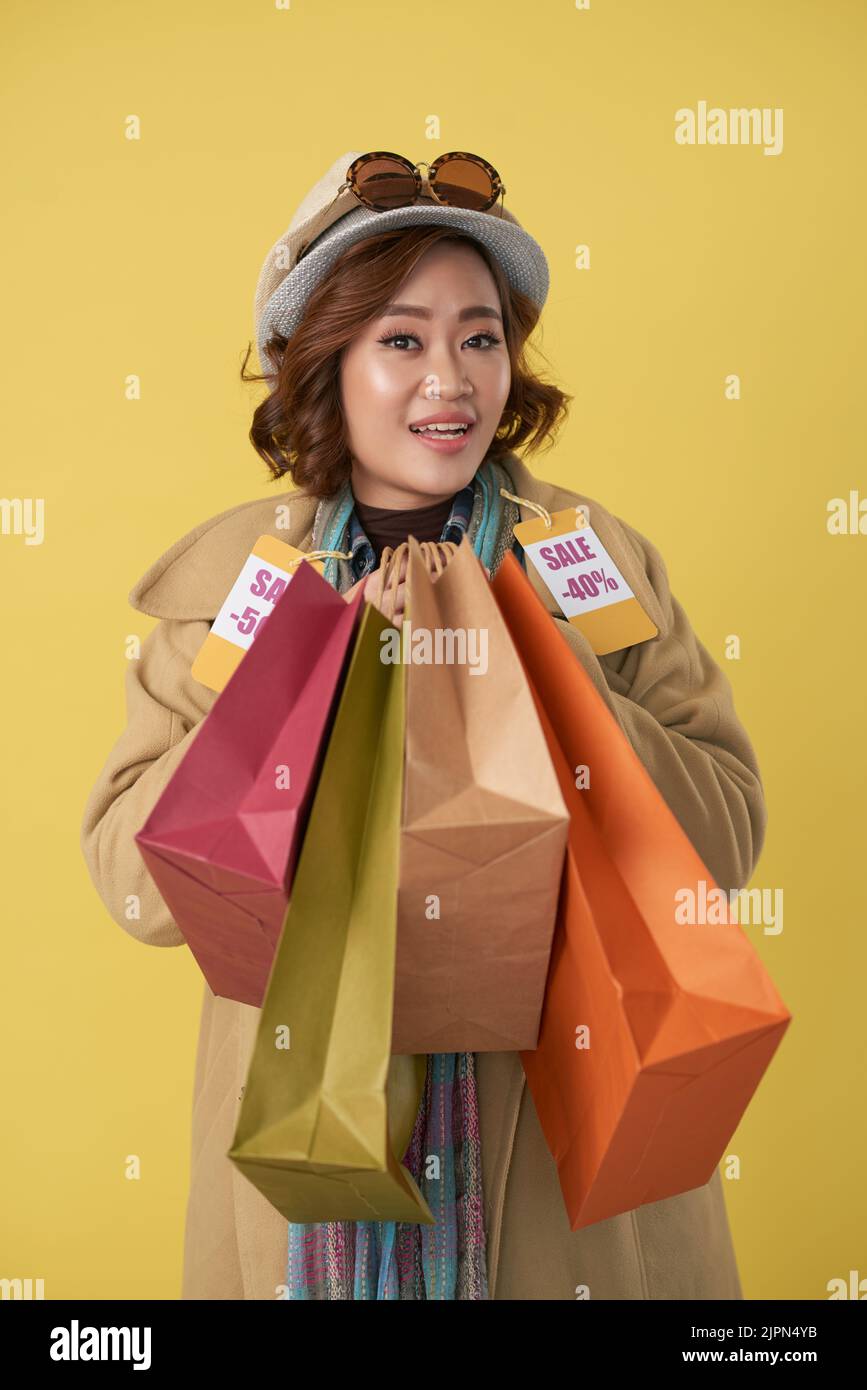 Happy beautiful Asian woman bought a lot of clothes on sale Stock Photo ...