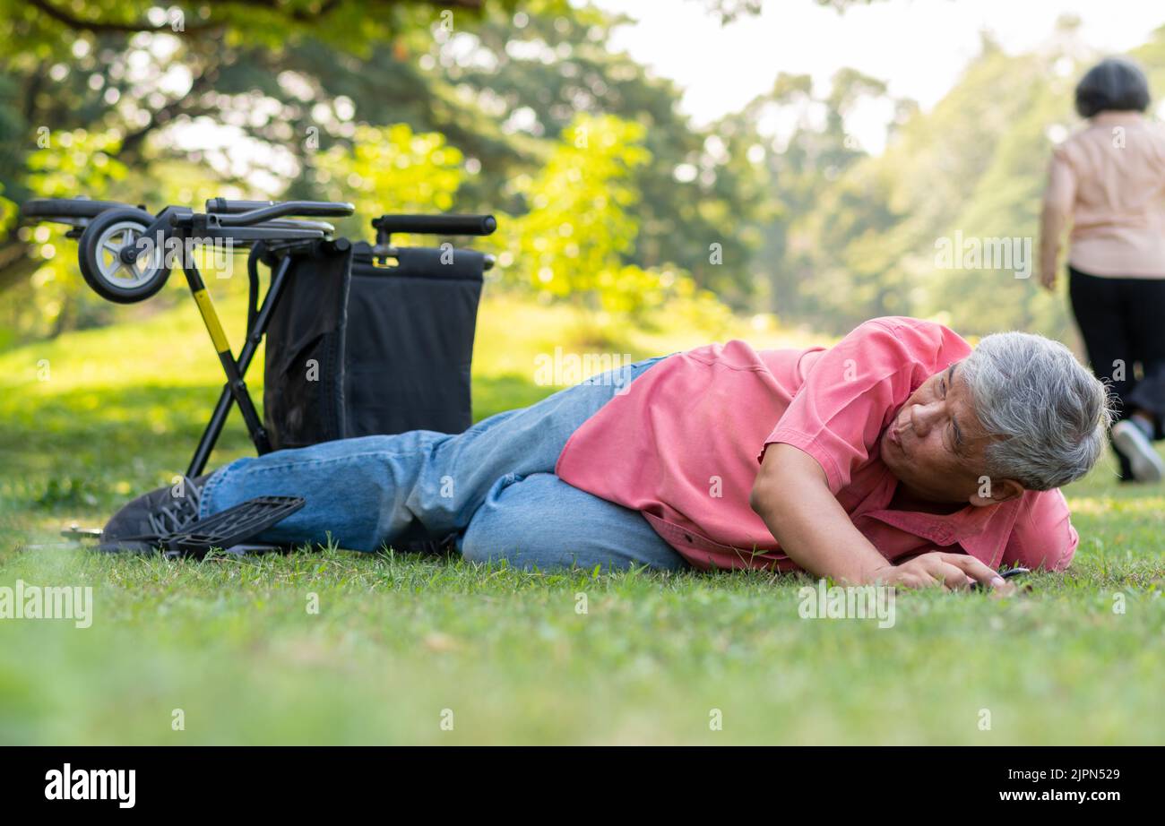 Asian senior man falling down from wheelchair on lying floor after ...