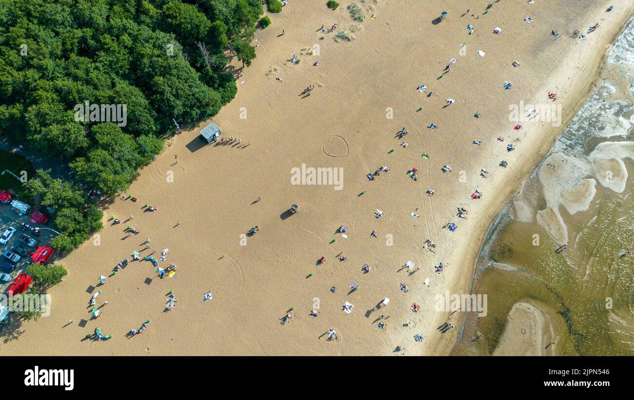 Drone view of the beach and people resting Stock Photo - Alamy