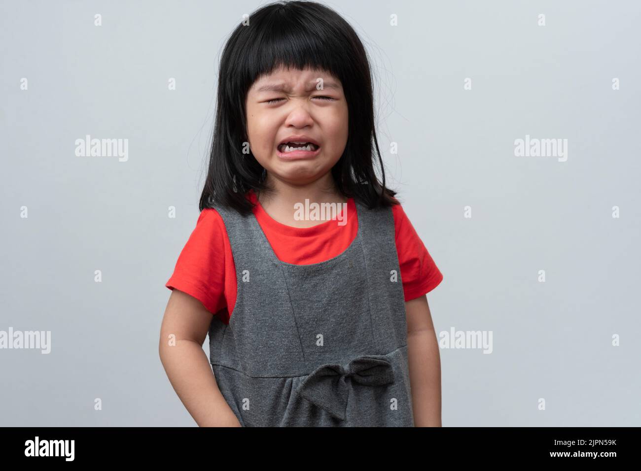 Portrait of Asian angry, sad and cry little girl on white isolated ...