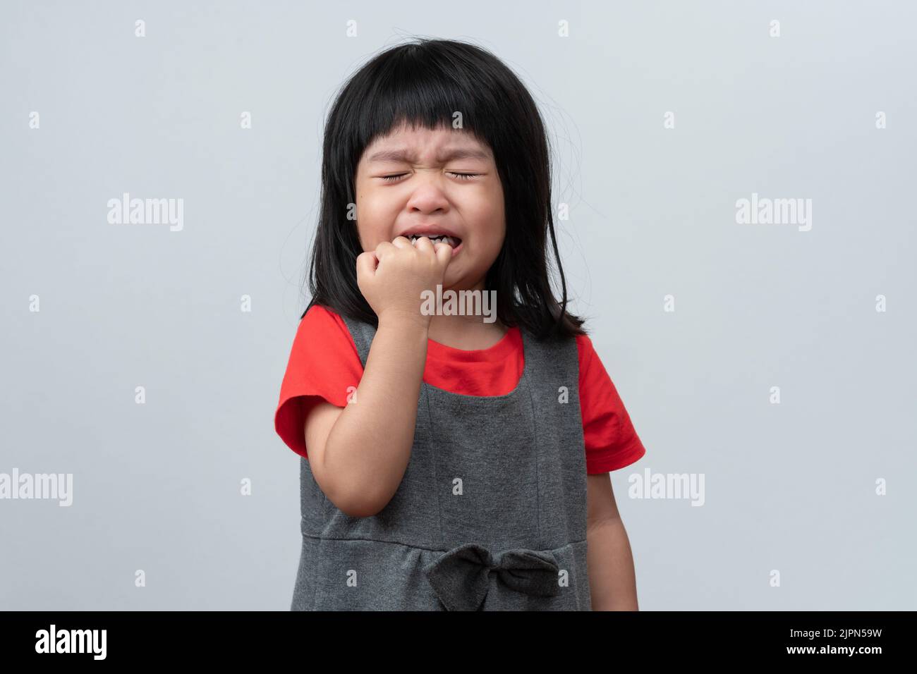Portrait of Asian angry, sad and cry little girl on white isolated ...