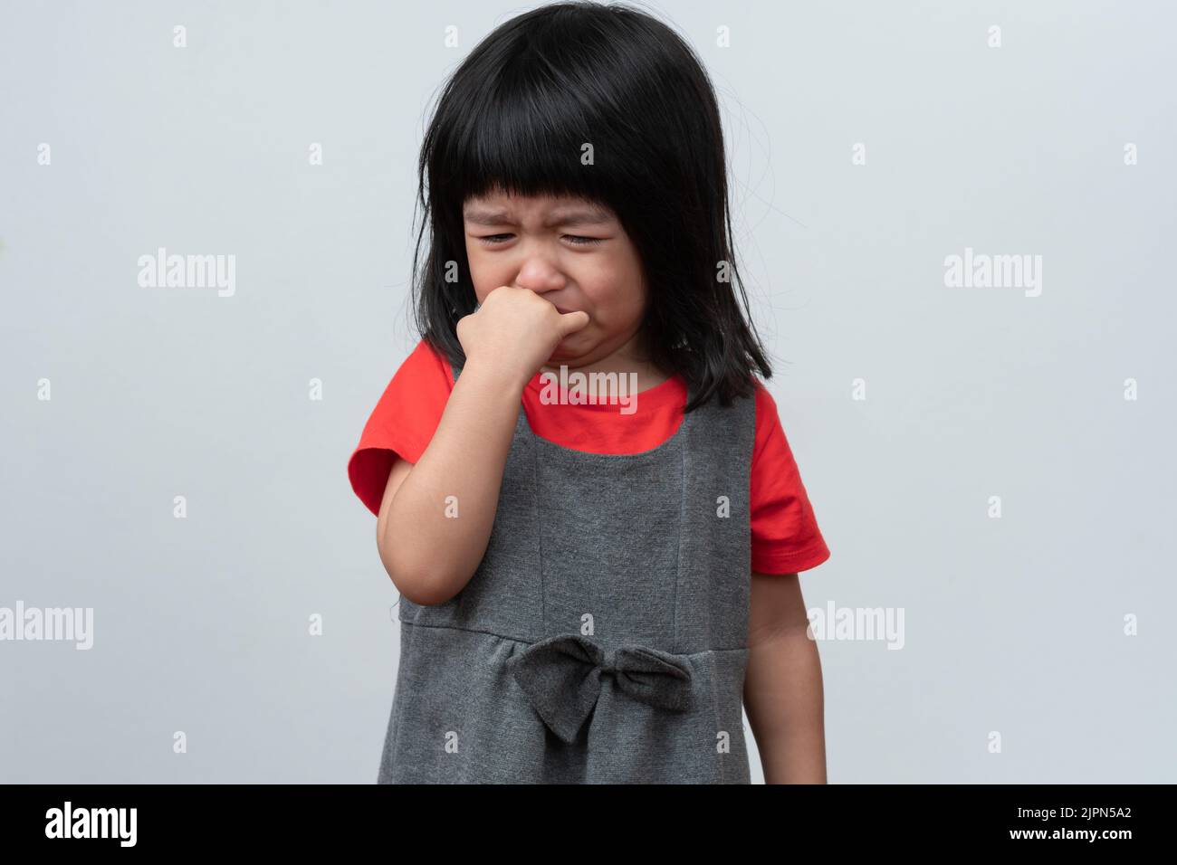 Portrait of Asian angry, sad and cry little girl on white isolated ...