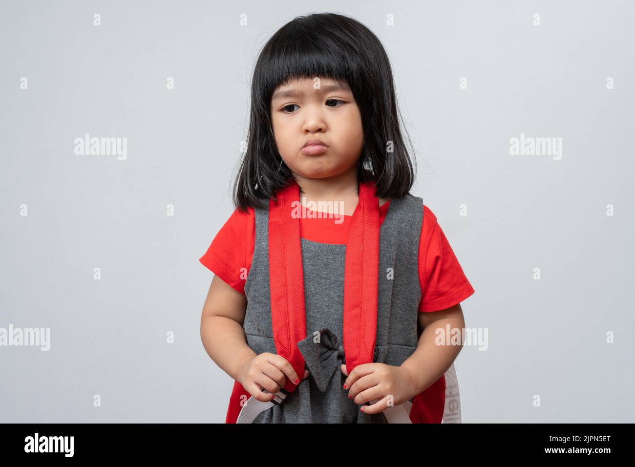 Portrait of Asian angry and sad little girl on white isolated ...