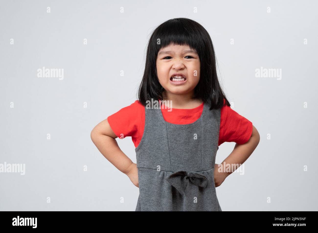 Portrait of Asian angry and sad little girl on white isolated ...