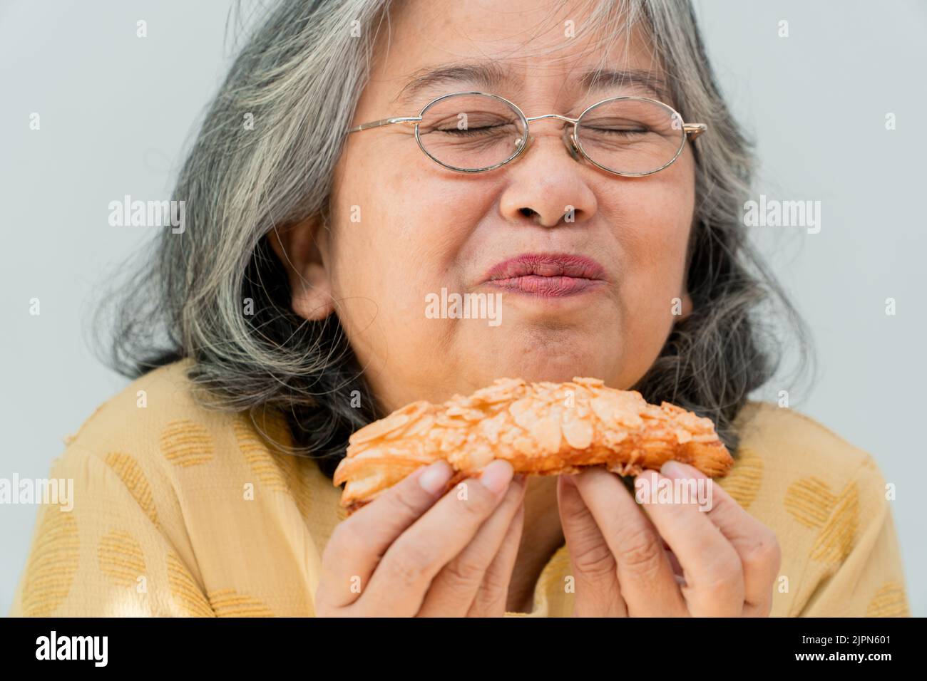 Happy Asian senior women enjoying eating pie Stock Photo - Alamy