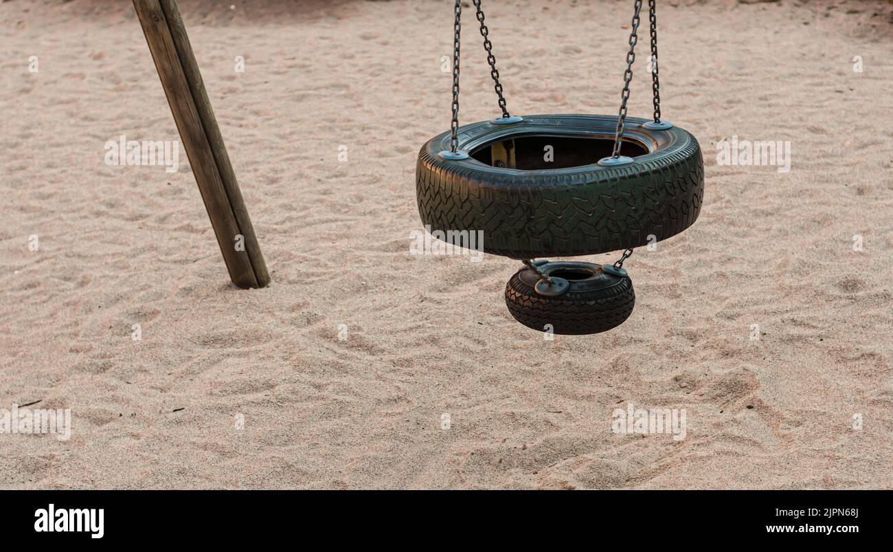 A tire swing in the playground Stock Photo - Alamy