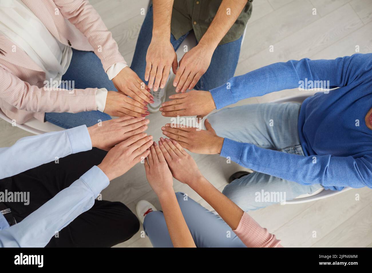 Hands together circle multiracial hi-res stock photography and images - Alamy