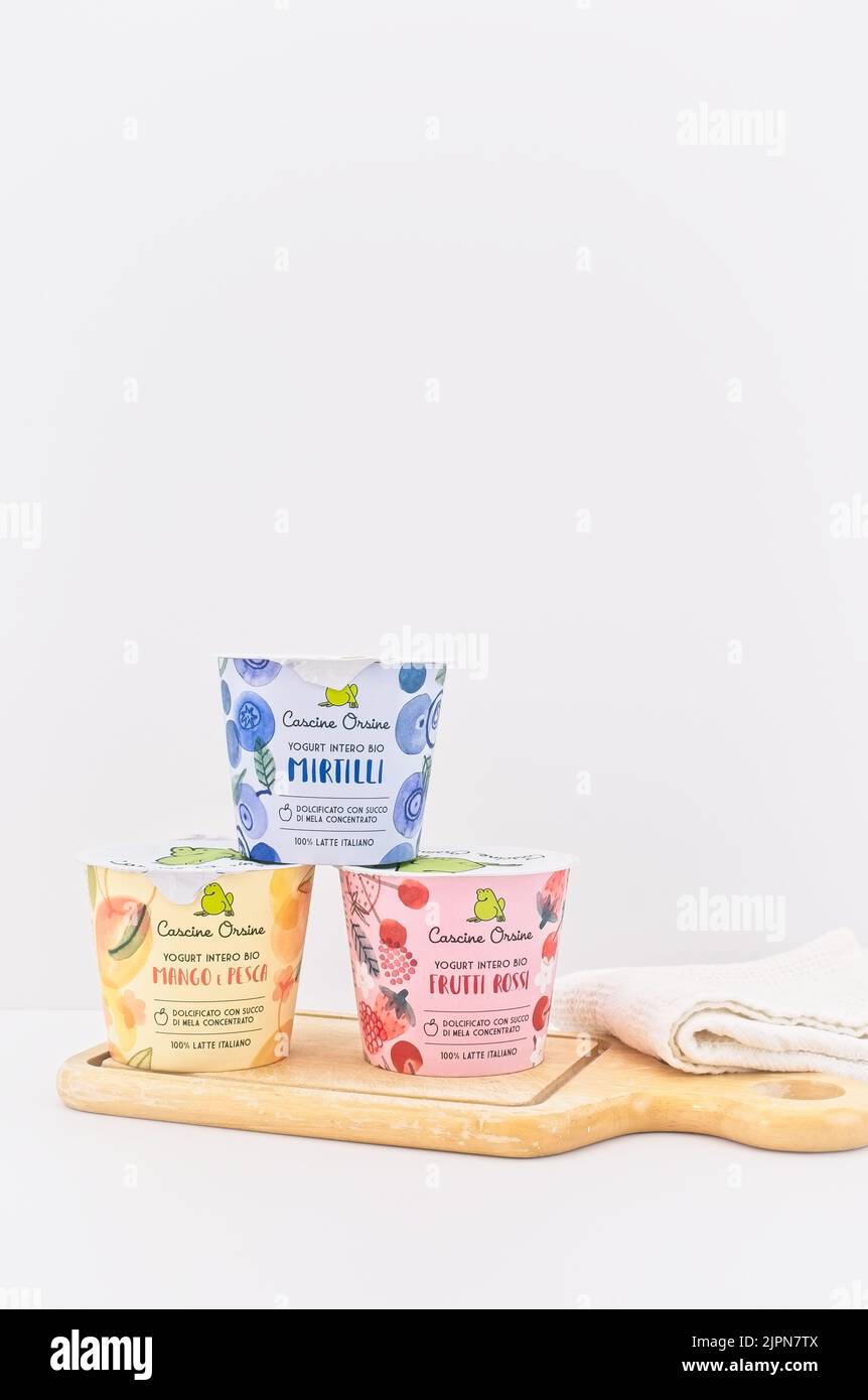 fruits organic farming yogurt jar with kitchenware on a white table ...