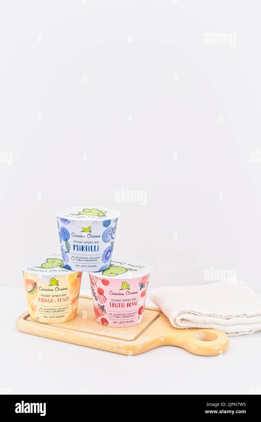 fruits organic farming yogurt jar with kitchenware on a white table ...