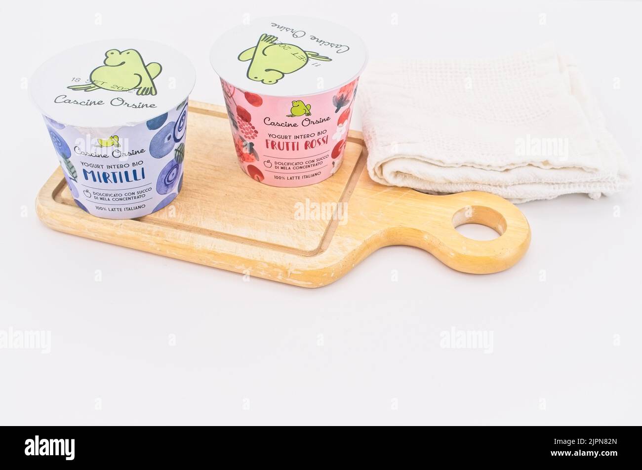 fruits organic farming yogurt jar with kitchenware on a white table ...