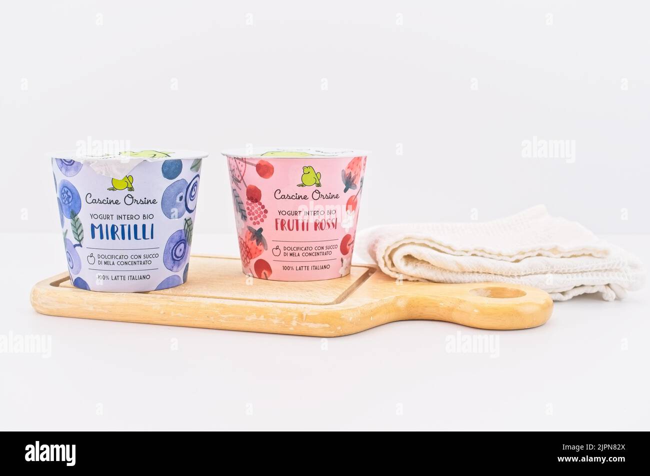 fruits organic farming yogurt jar with kitchenware on a white table ...