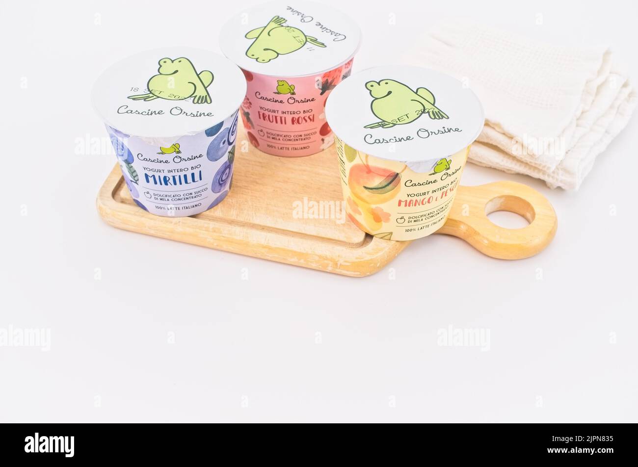 fruits organic farming yogurt jar with kitchenware on a white table ...