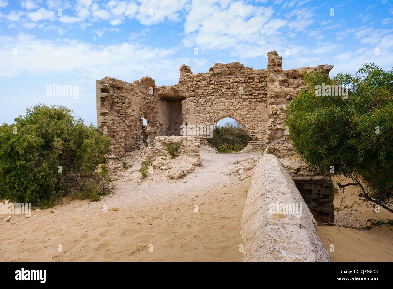 The historical Dar Sultan Palace ruins surrounded with lush bushes in ...