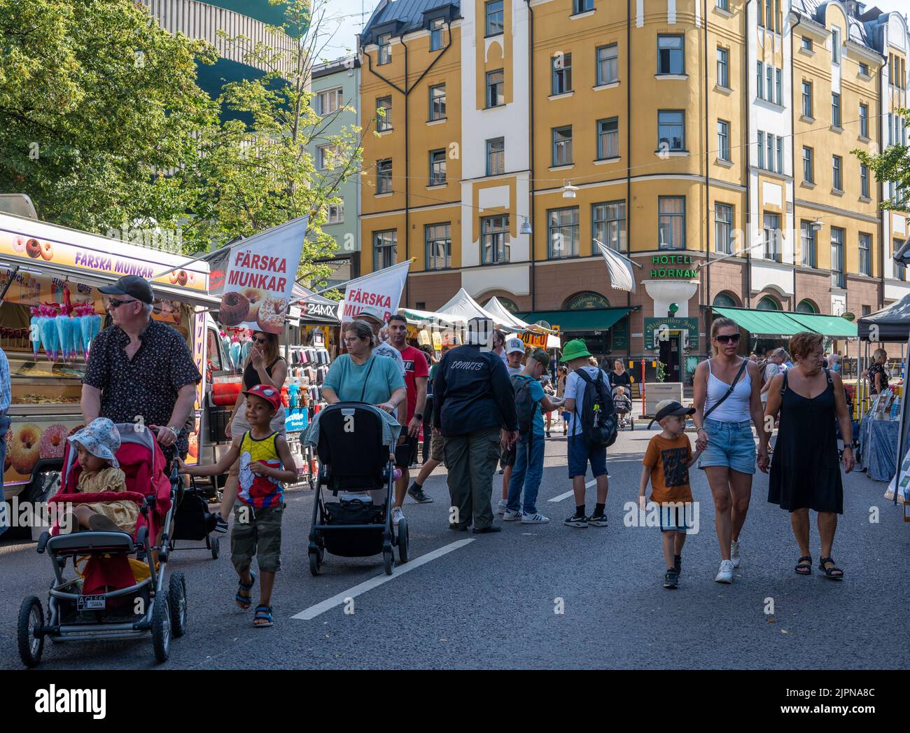 People enjoy the street market during the August fest. The August fest ...
