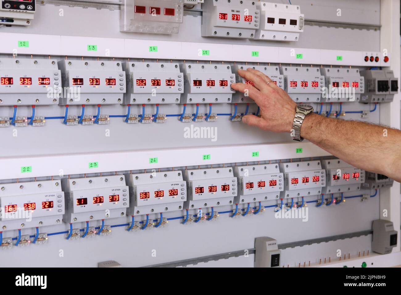 Service center for the repair of power voltage relays. Human checking ...