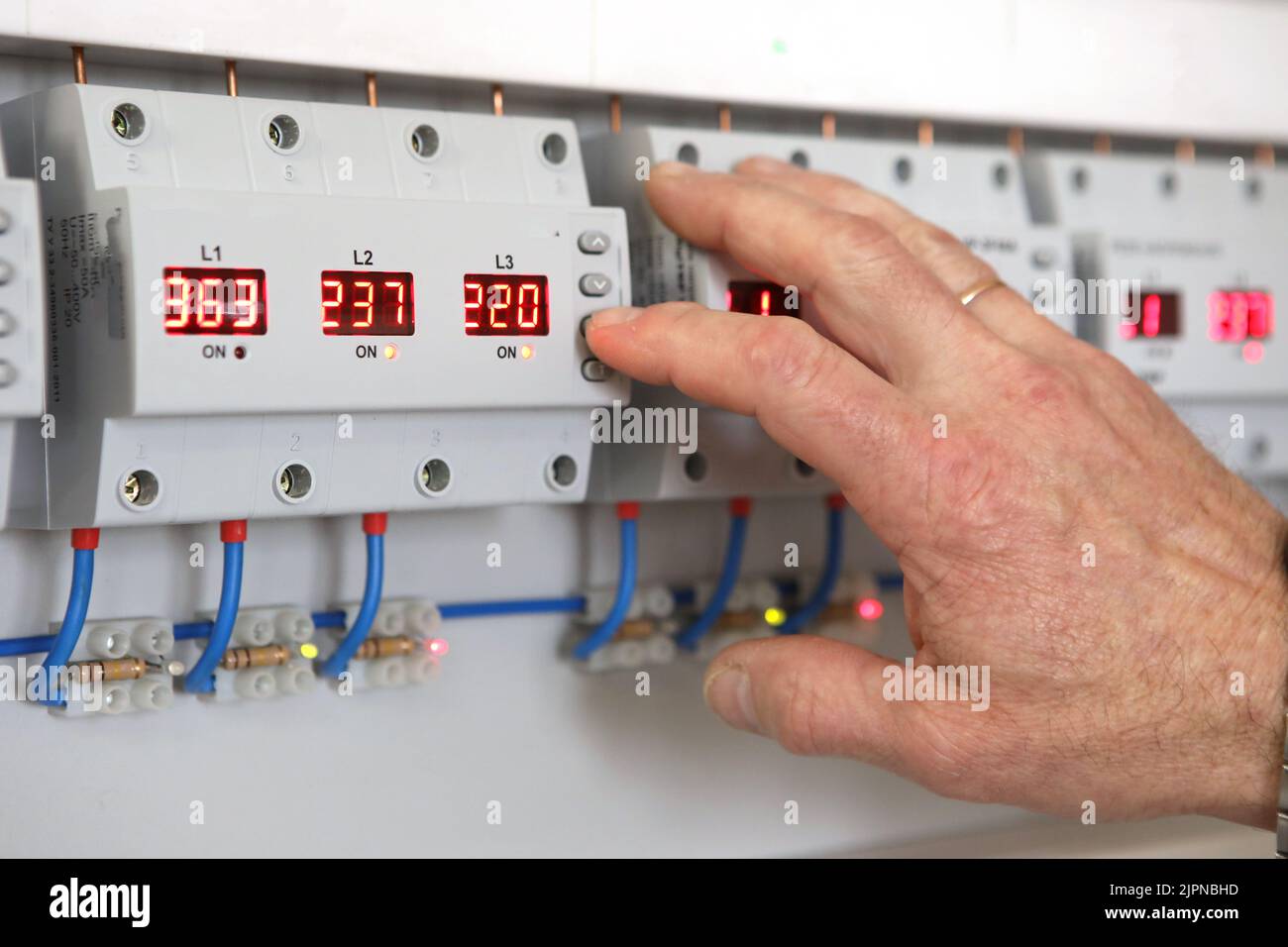 Service center for the repair of power voltage relays. Human checking ...