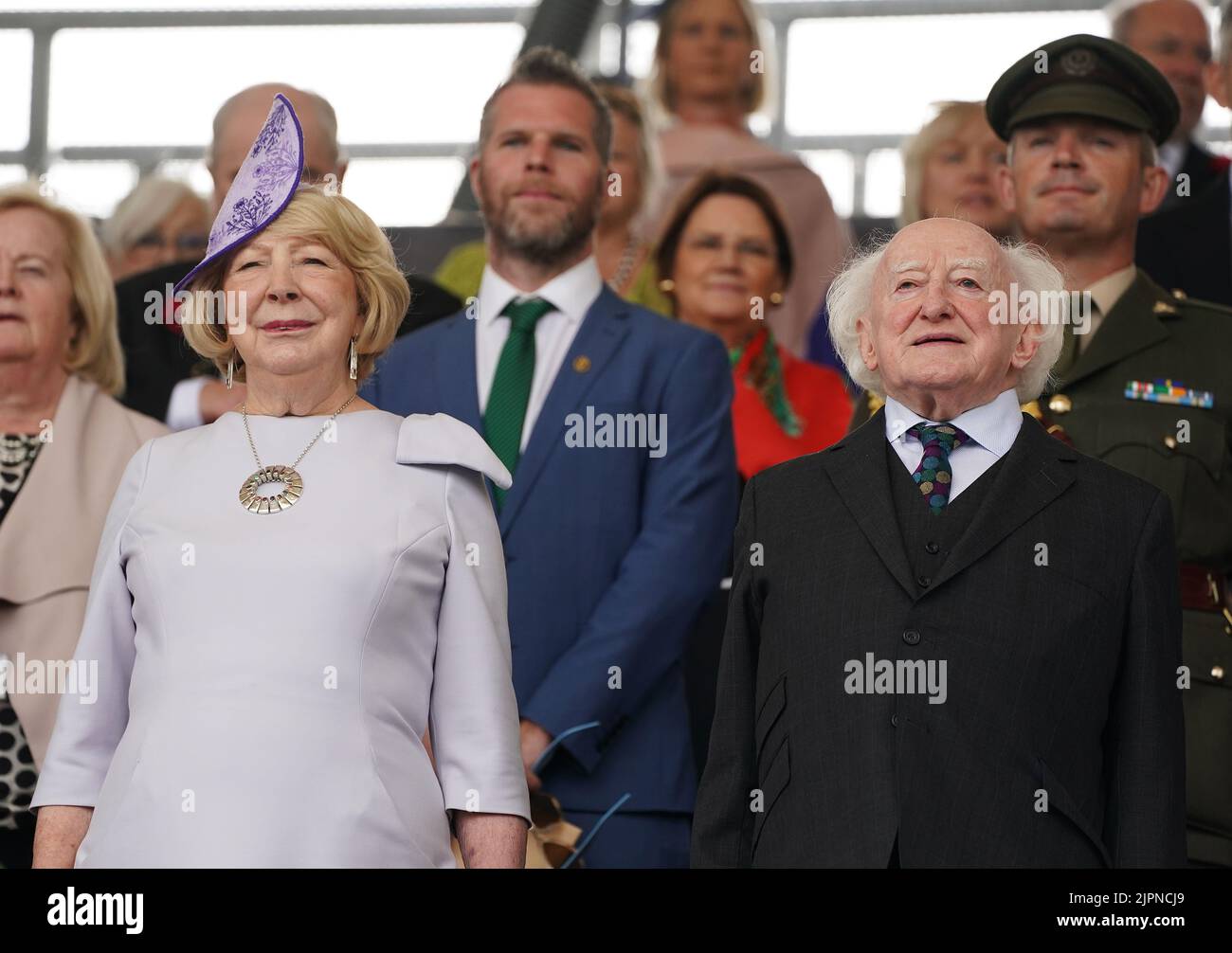 President Michael D Higgins and his wife Sabina stand for the National ...