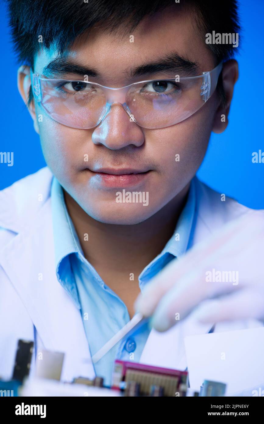Asian engineer assembling computer hi-res stock photography and images ...