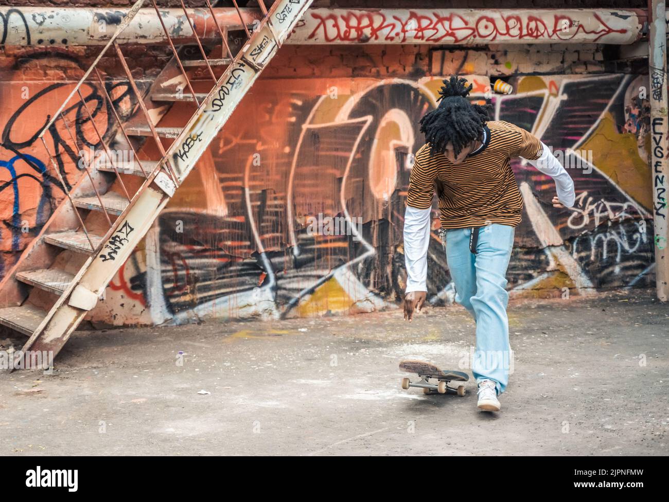 Young handsome stylish black man with natural hair dreadlocks ...