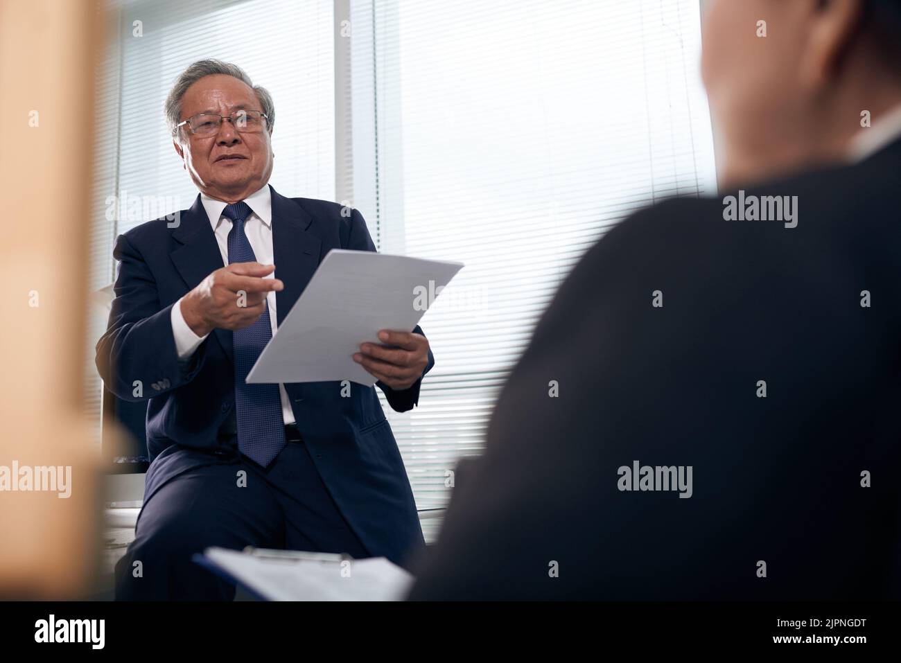 Professional serious asian senior hi-res stock photography and images ...