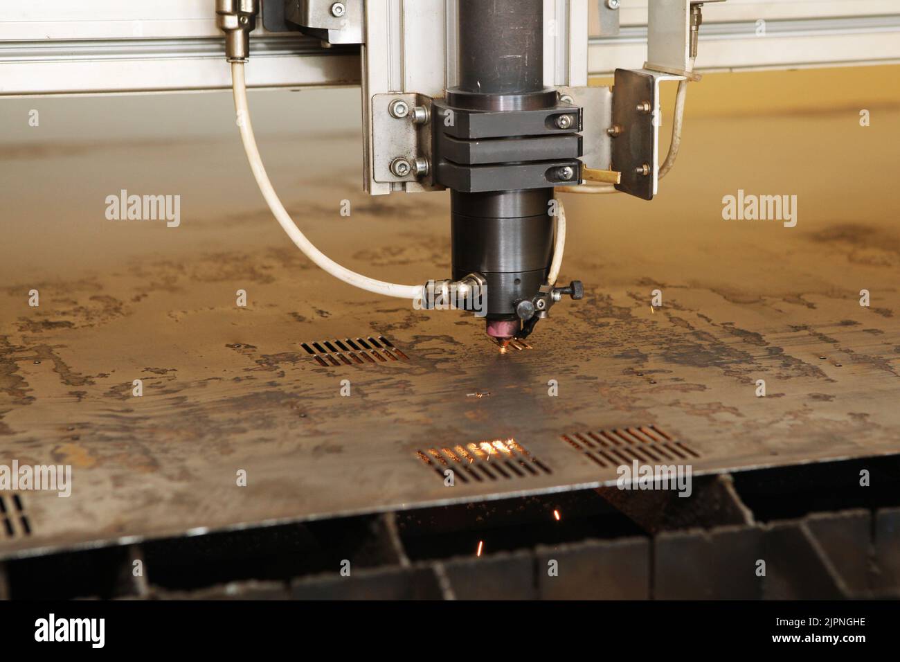 Plasma cutting CNC machine cuts metal material with sparks, industry ...