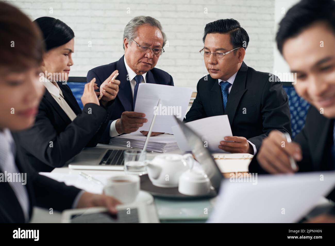 Professional busy senior asian hi-res stock photography and images - Alamy