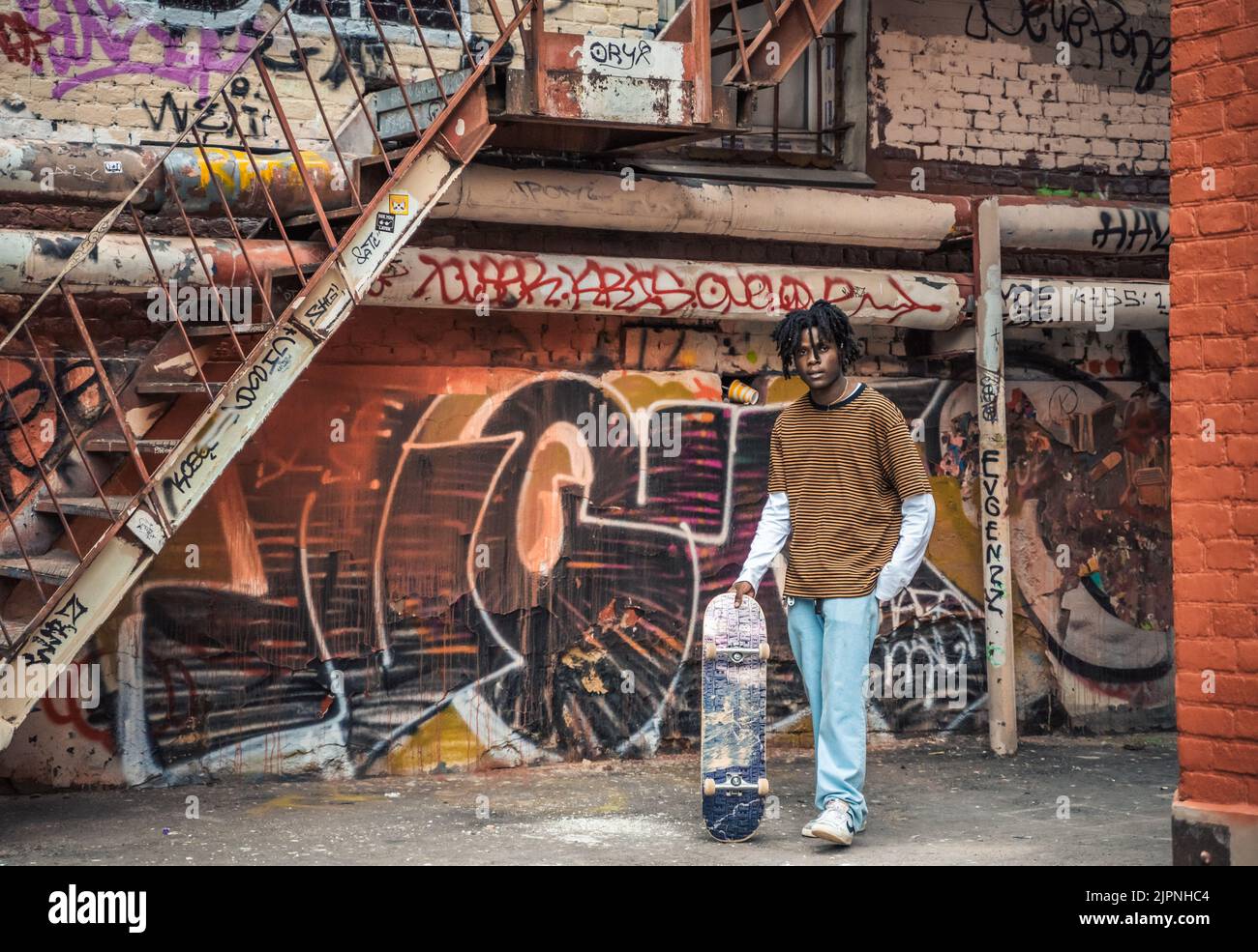 Young handsome stylish black man with natural hair dreadlocks ...